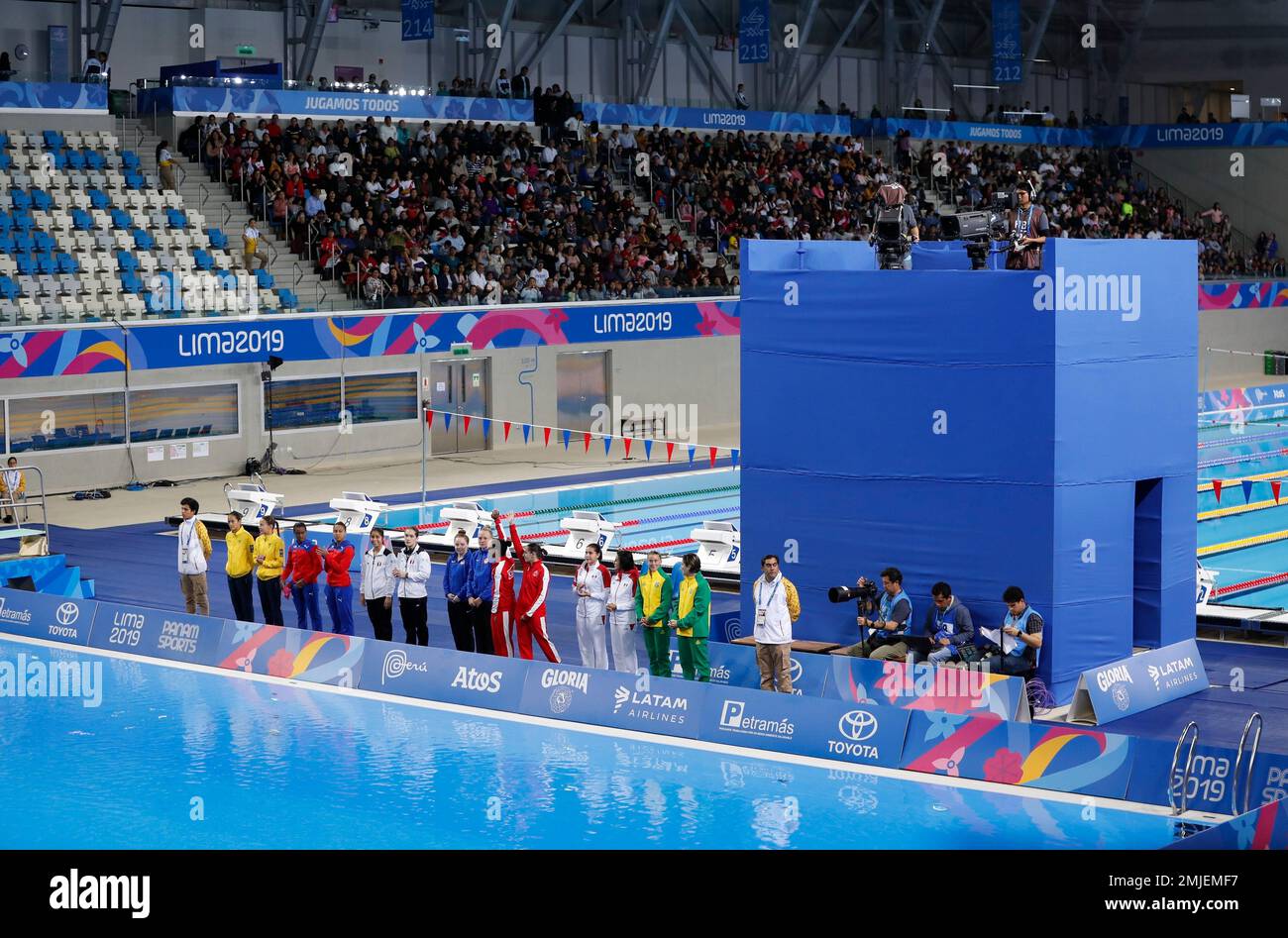Swimmers line up before competing in the finals of the women's 3 meter ...