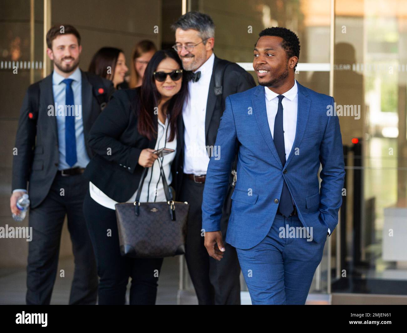 Rapper Marcus Gray, right, smiles as his attorney, Michael A. Kahn ...