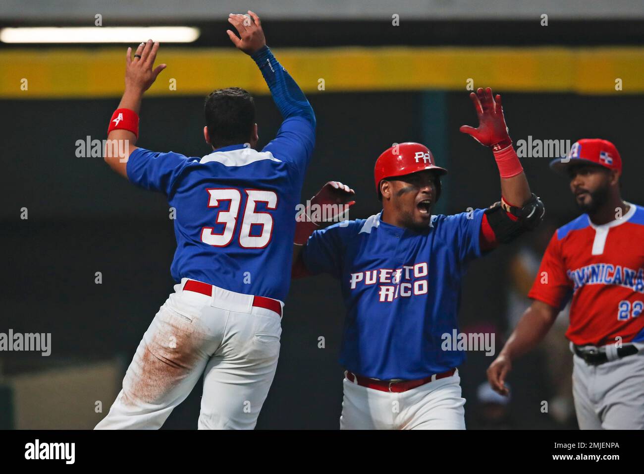 Puerto Rican players celebrate after defeating the Dominican Republic ...