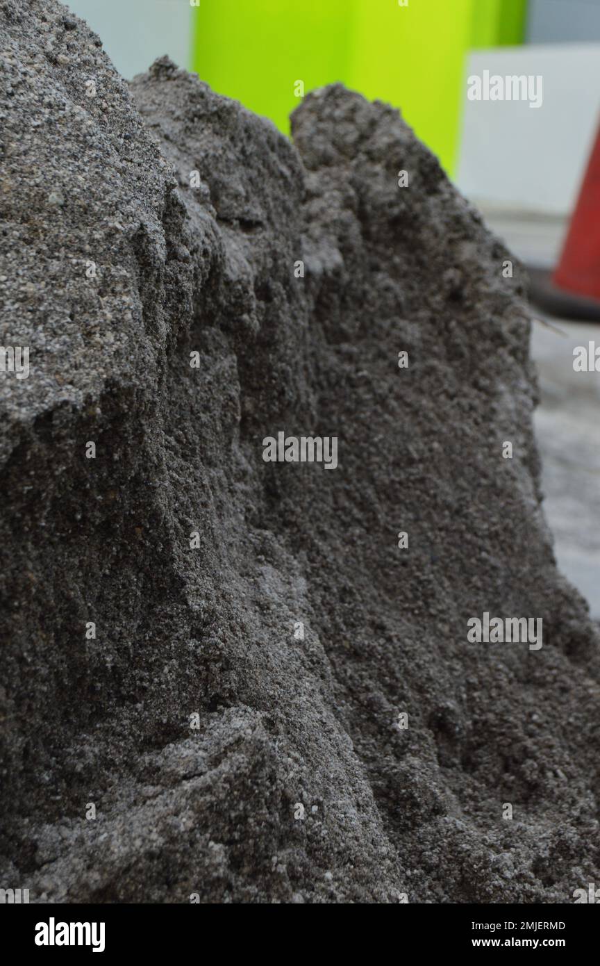 portrait of gray sand dunes as a raw material for building (walls ...