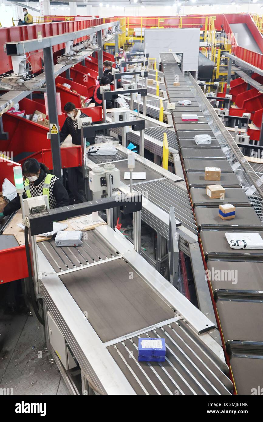 NANTONG, CHINA - JANUARY 28, 2023 - Staff members sort express ...