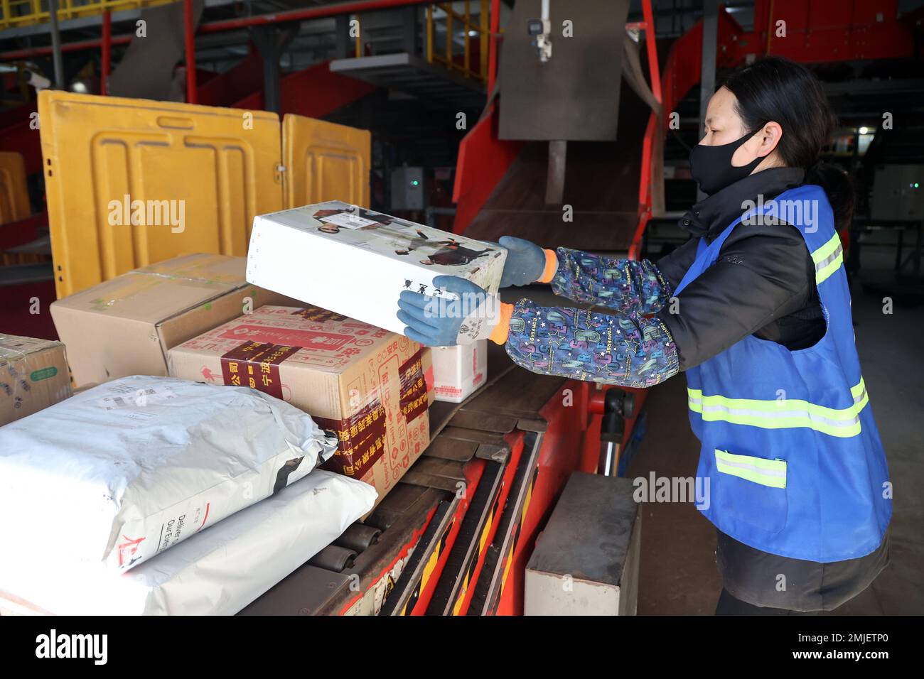 NANTONG, CHINA - JANUARY 28, 2023 - Staff members sort express ...