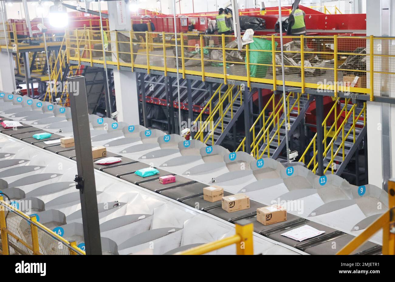 NANTONG, CHINA - JANUARY 28, 2023 - Staff members sort express ...