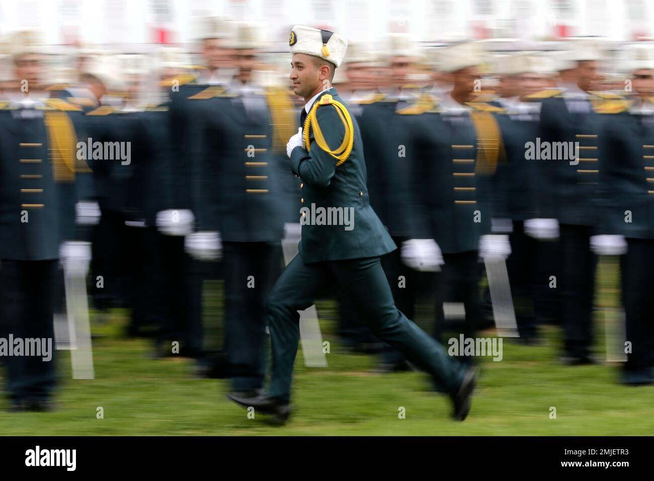 In this photo taken with a slow shutter speed, Lebanese officers parade ...