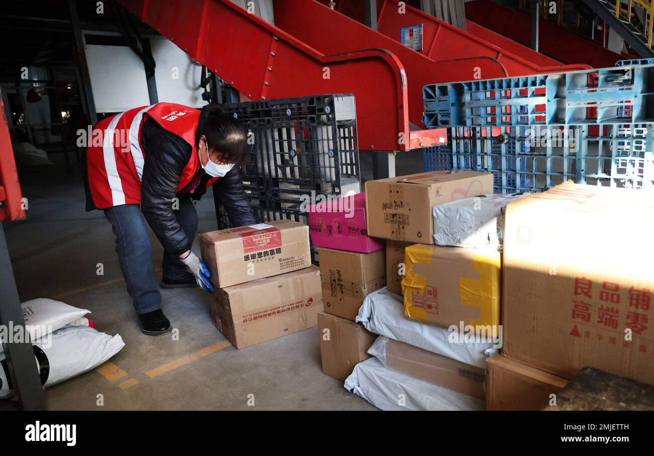 NANTONG, CHINA - JANUARY 28, 2023 - Staff members sort express ...