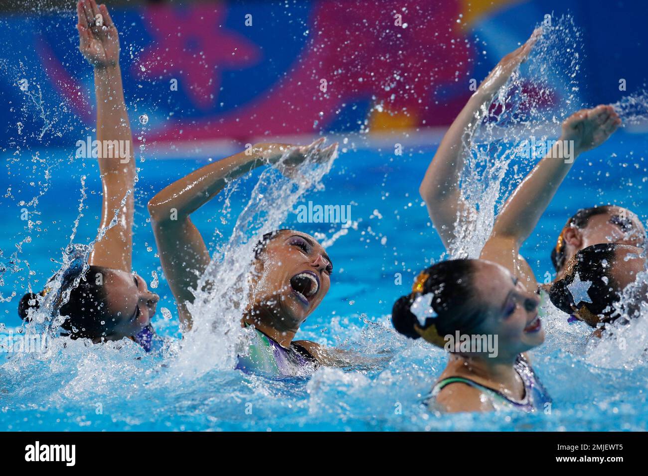 Members of Mexico's artistic swimming team compete in the free routine ...