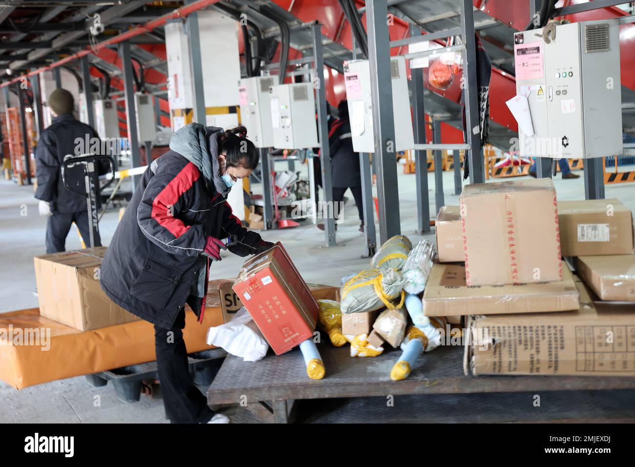 NANTONG, CHINA - JANUARY 28, 2023 - Staff members sort express ...