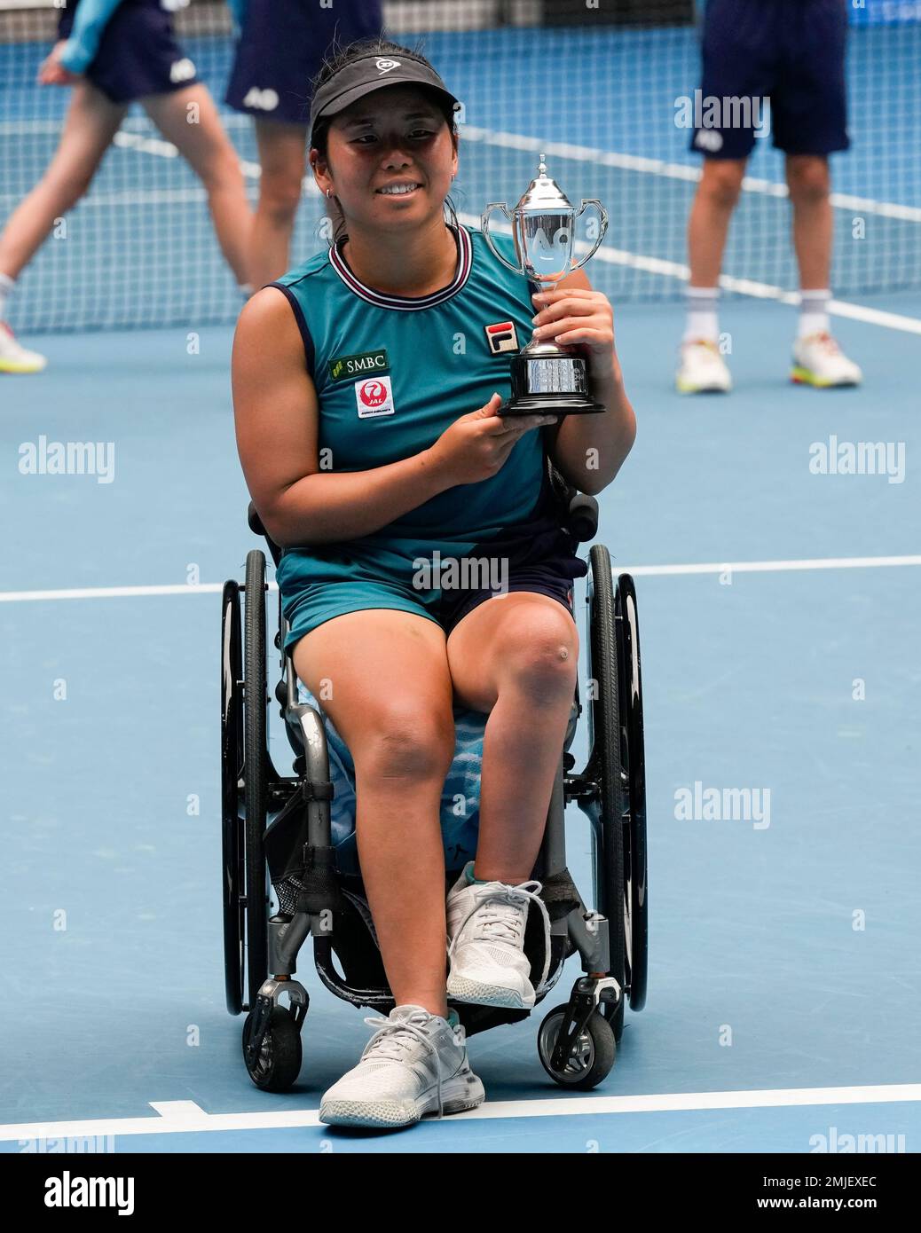 Yui Kamiji of Japan poses with her trophy after losing the women's ...