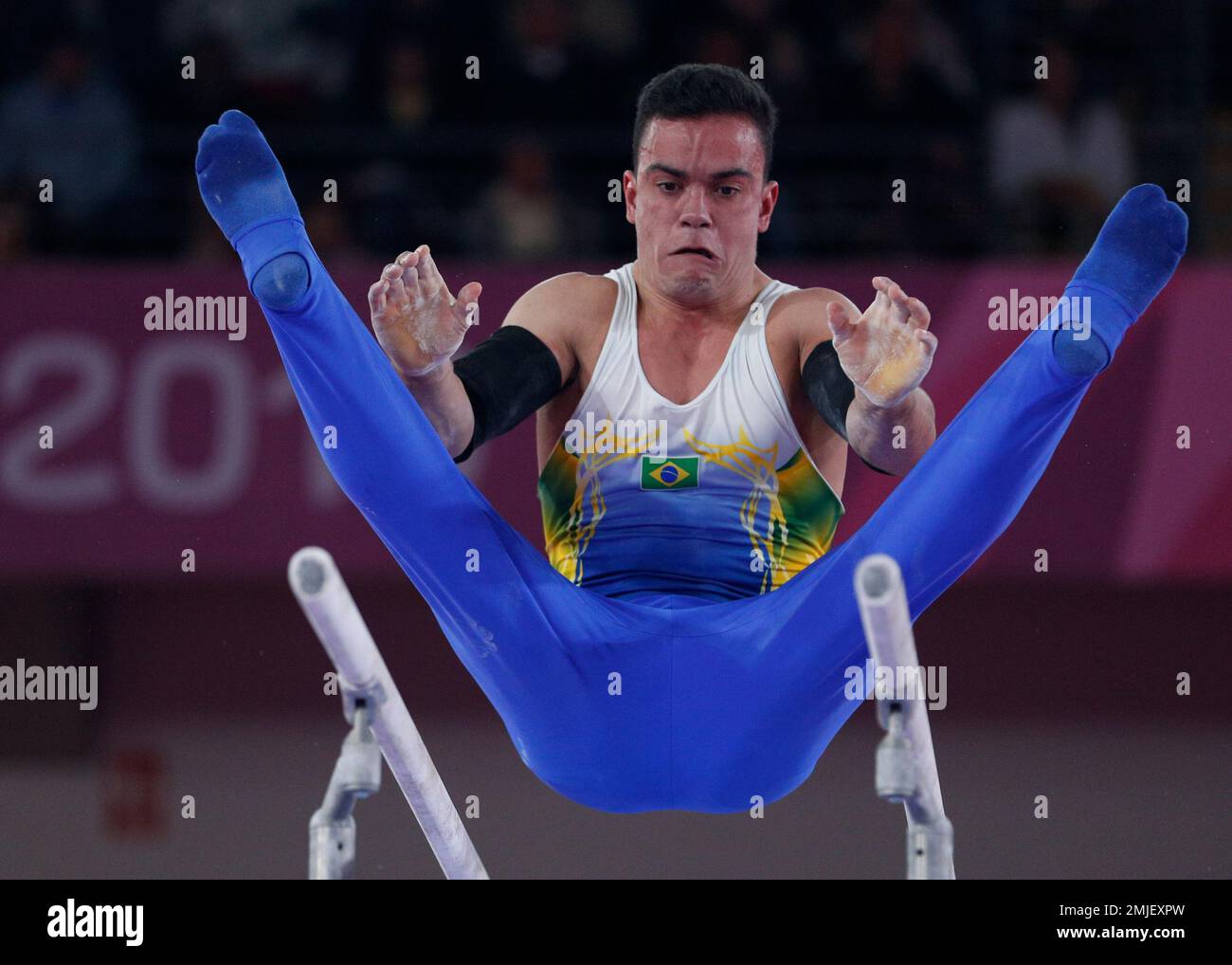 Caio Souza of Brazil competes to win silver on the parallel bars in the ...