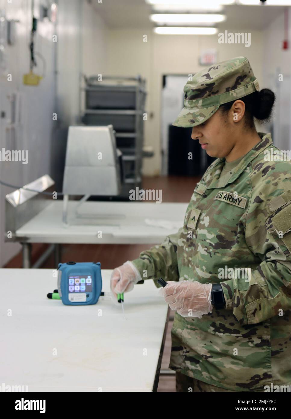 PV2 Kimberly Rios conducts testing on the surfaces of one of the ...