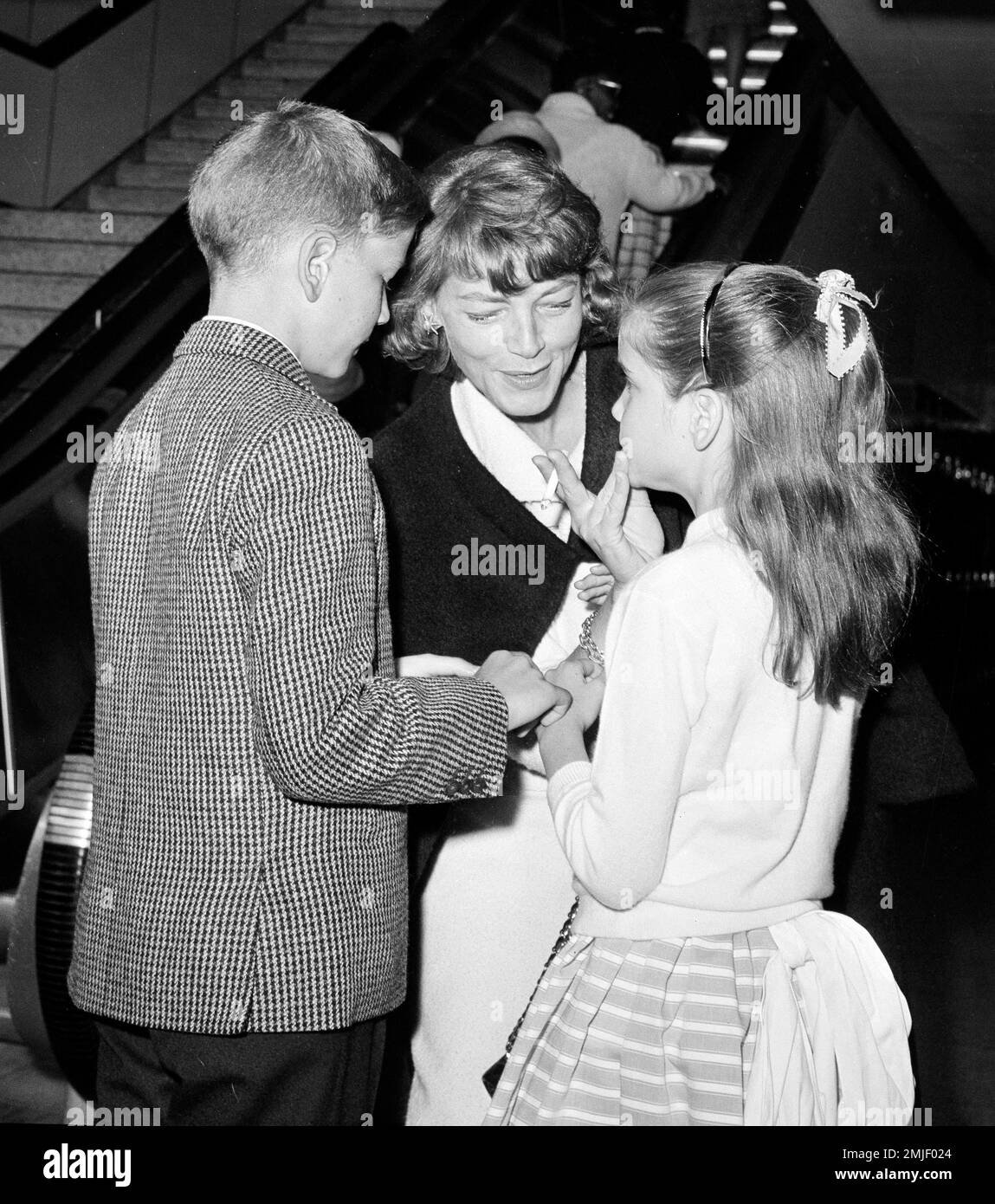 Actor Lauren Bacall, center, is welcomed home by her two children ...
