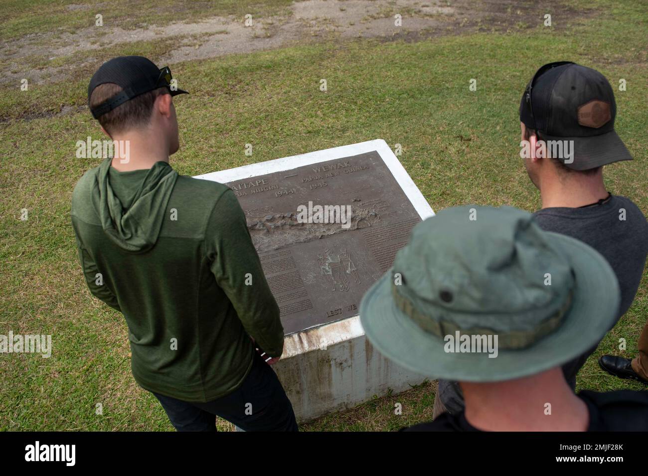 Members of a Defense POW/MIA Accounting Agency (DPAA) recovery team ...