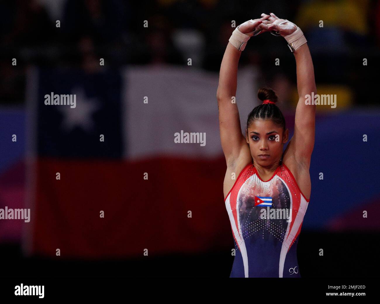 Marcia Vidiaux of Cuba stretches her shoulders as she waits for the go ...