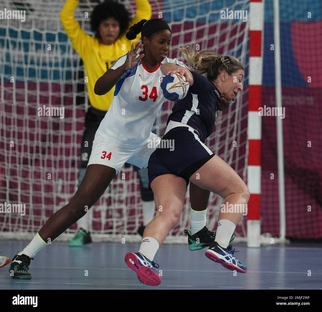 Sarah Gascon, of the United States, right, moves around Jennifer Toledo ...