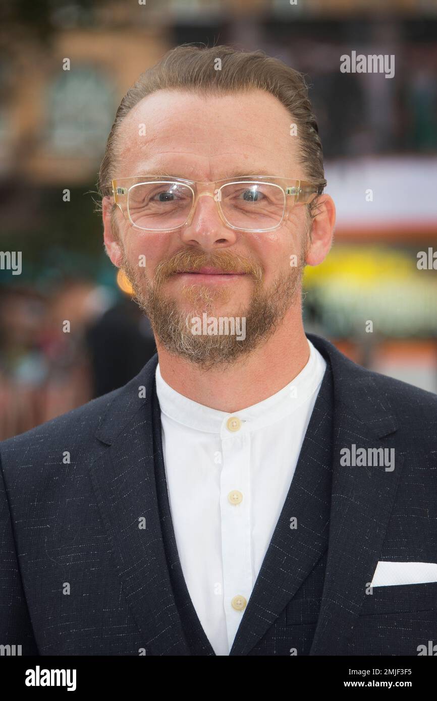 Actor Simon Pegg poses for photographers upon arrival at the UK ...