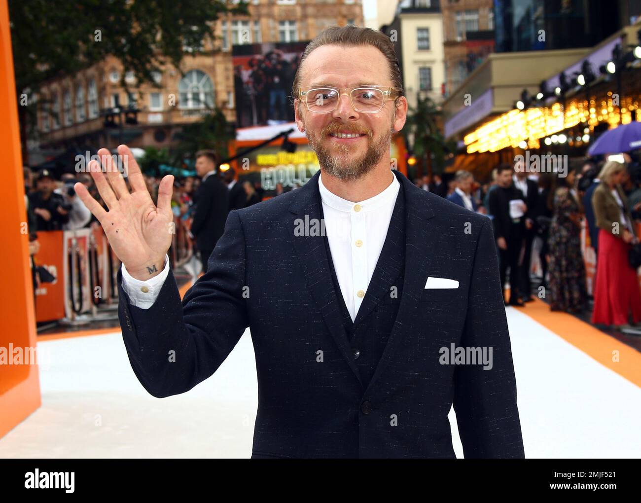 Actor Simon Pegg poses for photographers upon arrival at the UK ...