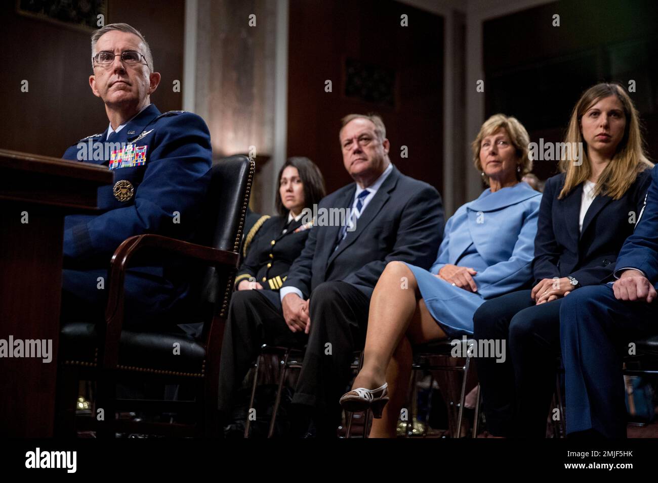 Gen. John Hyten, left, accompanied by members of his family including ...