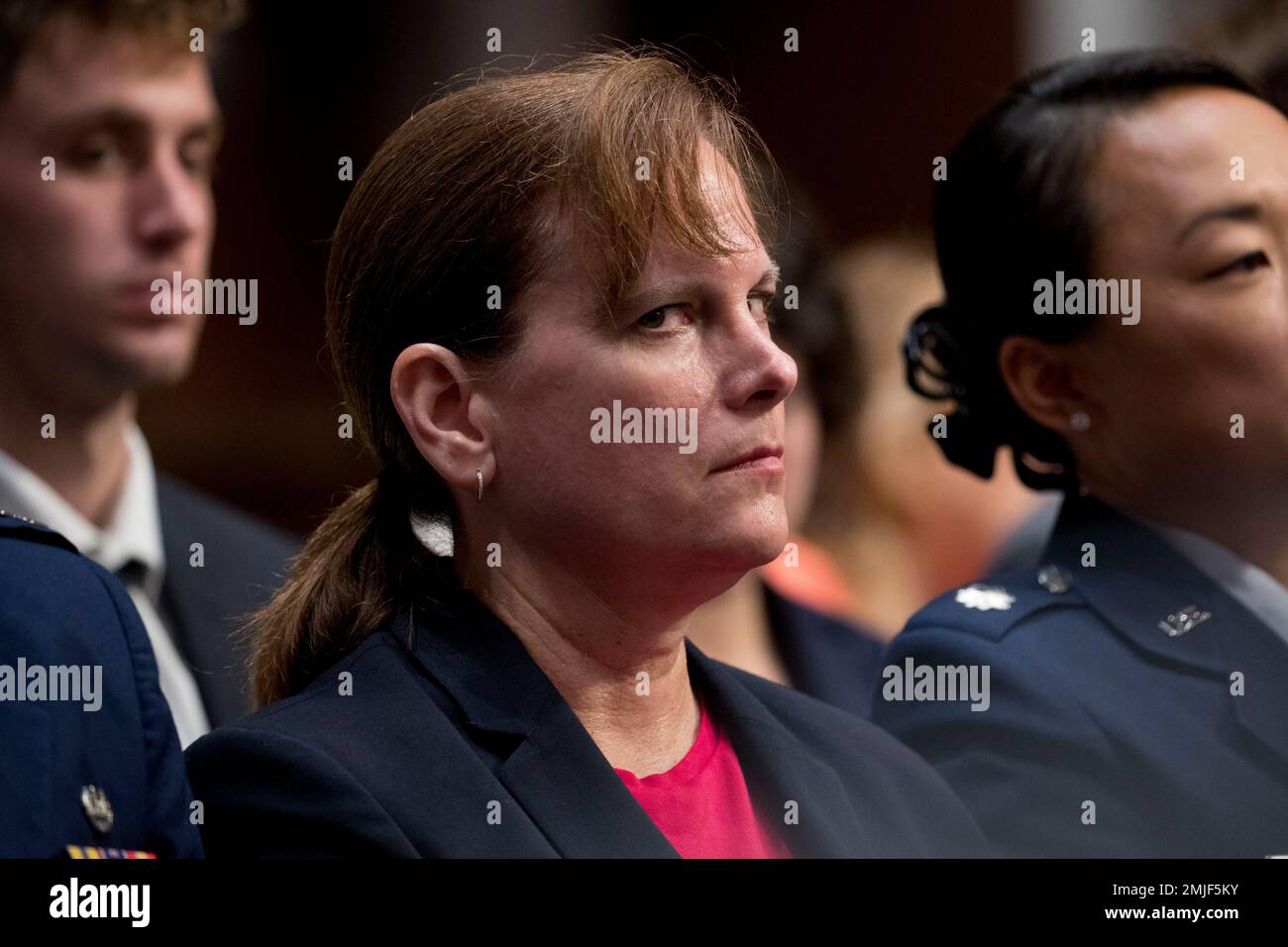 Former aide Army Col. Kathryn Spletstoser, sits in the audience as Gen ...