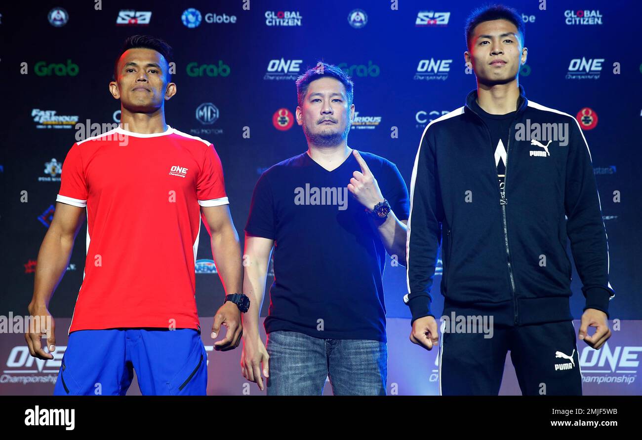 Edward Kelly, left, of the Philippines and China's Xie Bin, right, pose ...