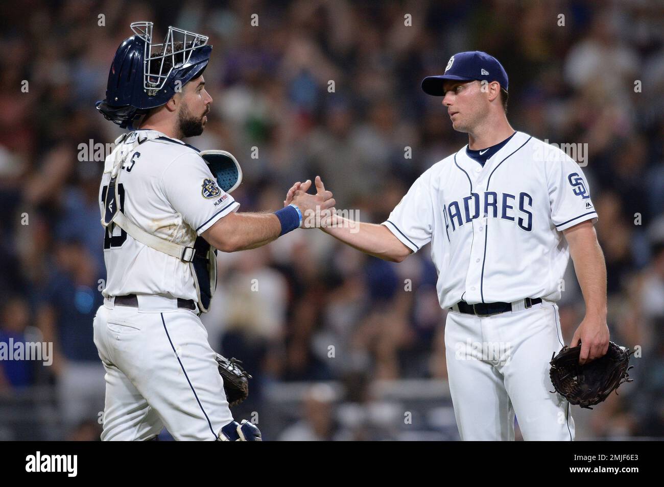 San Diego Padres' Austin Hedges, left, and Robbie Erlin celebrate after ...