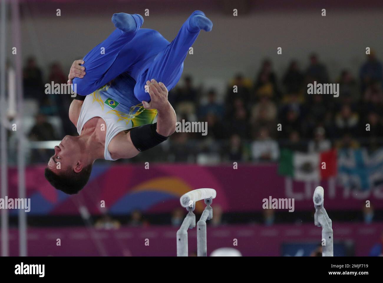 Brazil's Caio Souza competes on the parallel bars in the men's ...