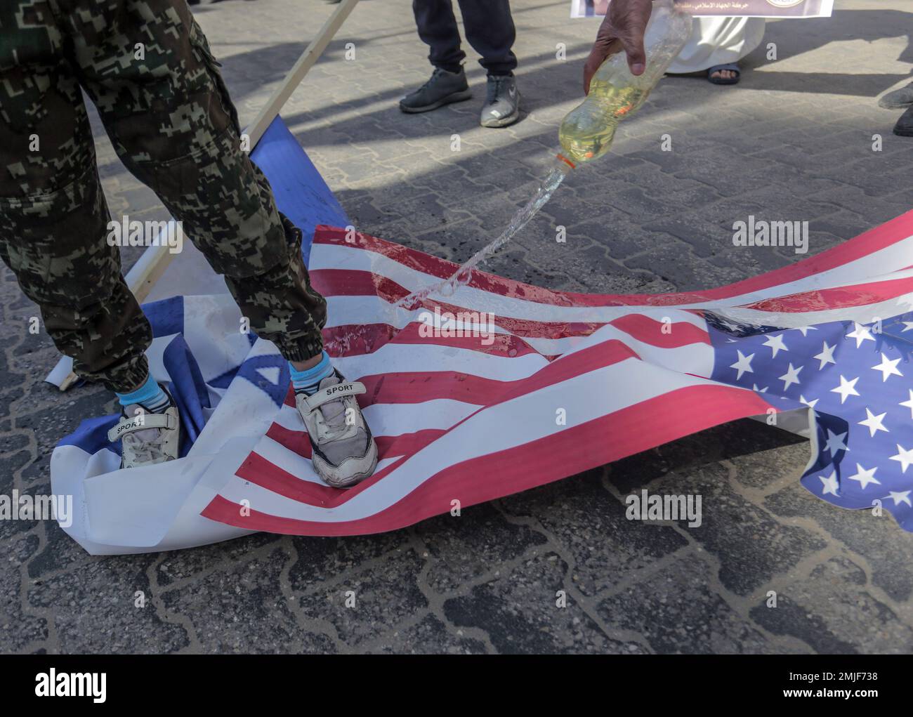 A Palestinian supporter of the Islamic Jihad movement tramples on the ...