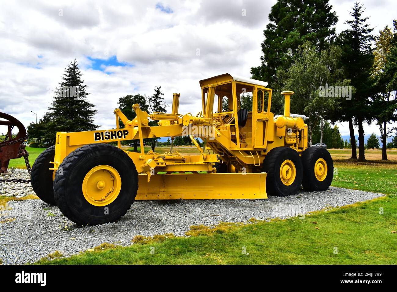 yellow champion earth moving grader on display at public park. from a ...