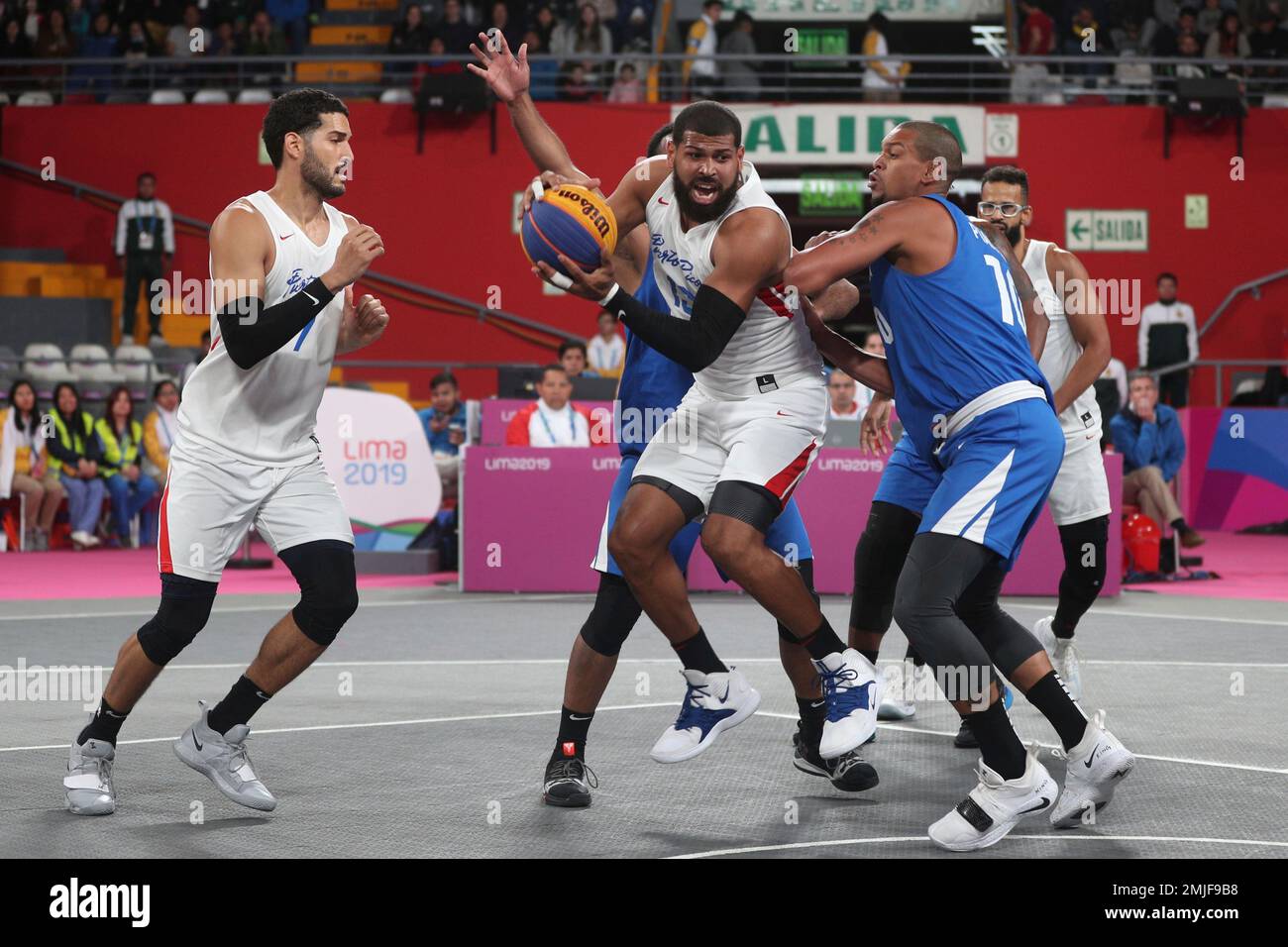 Angel Matias of Puerto Rico, center, is pressured by Bryan Piantini of ...