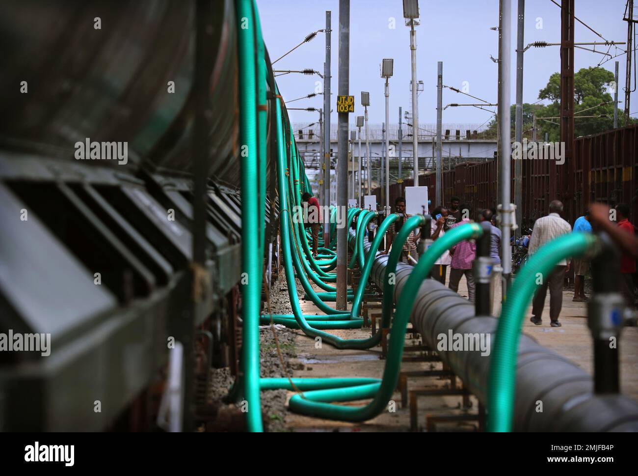 In this Wednesday, July 17, 2019, photo, hose-pipes are used to fill ...