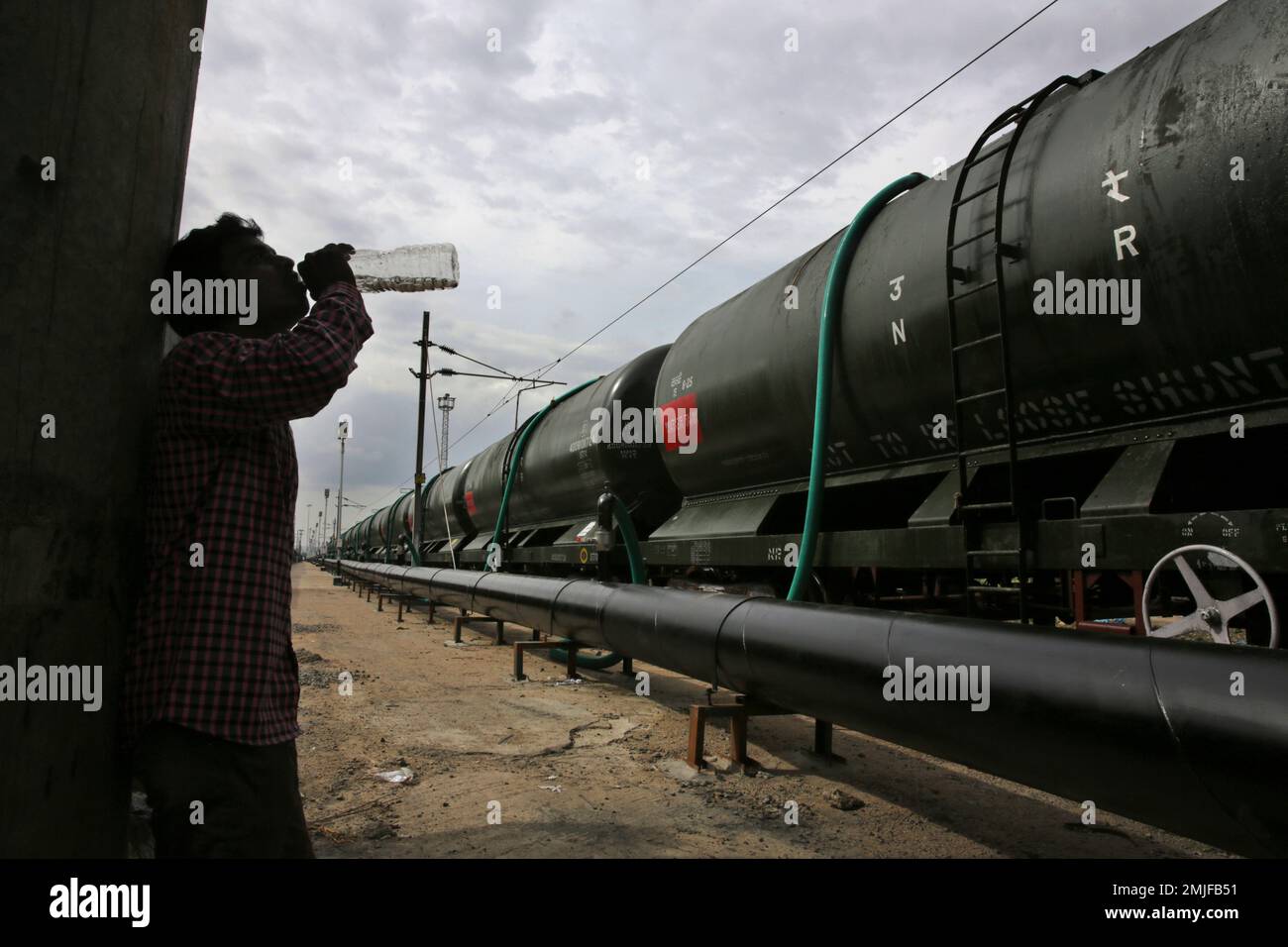 In this Wednesday, July 17, 2019, photo, a worker takes a break to ...