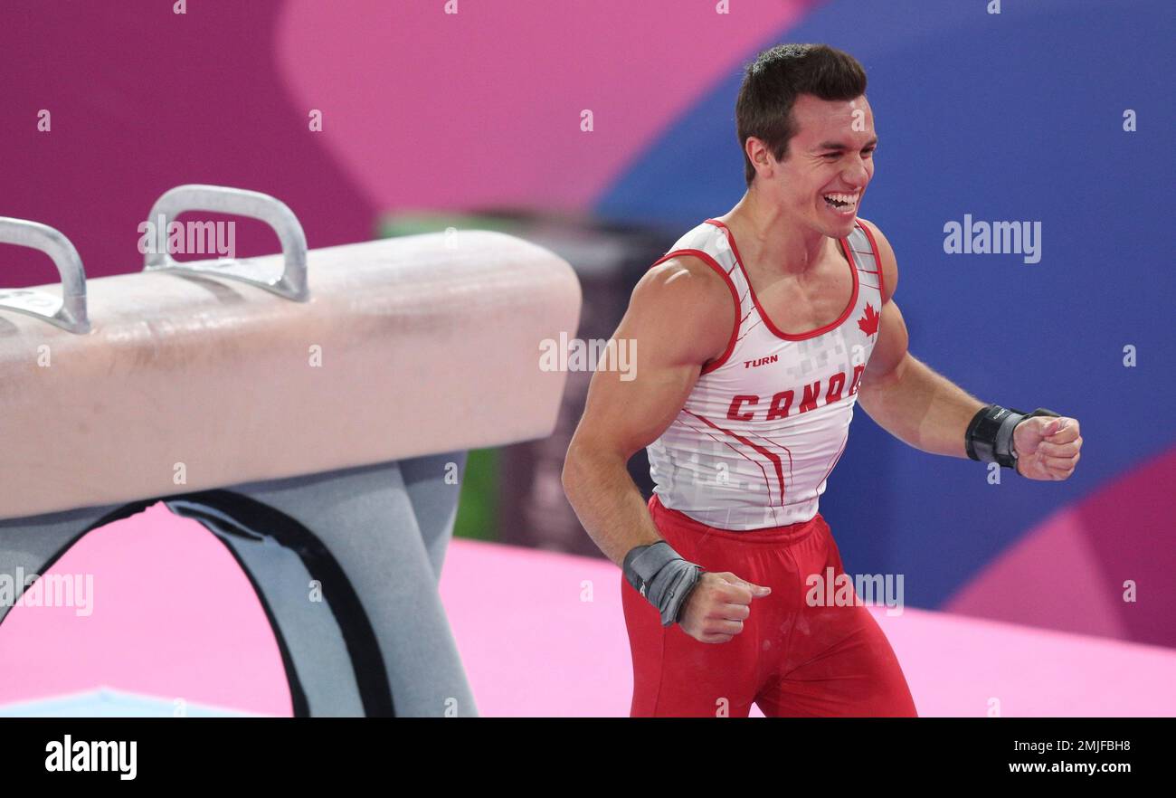 Rene Cournoyer of Canada celebrates after his routine on the pommel ...