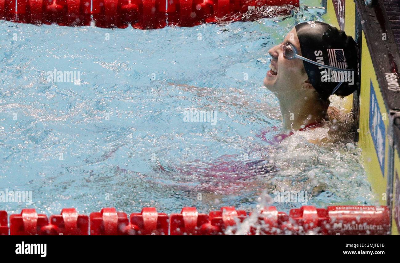 United States' Regan Smith reacts after her backstroke leg in the women ...