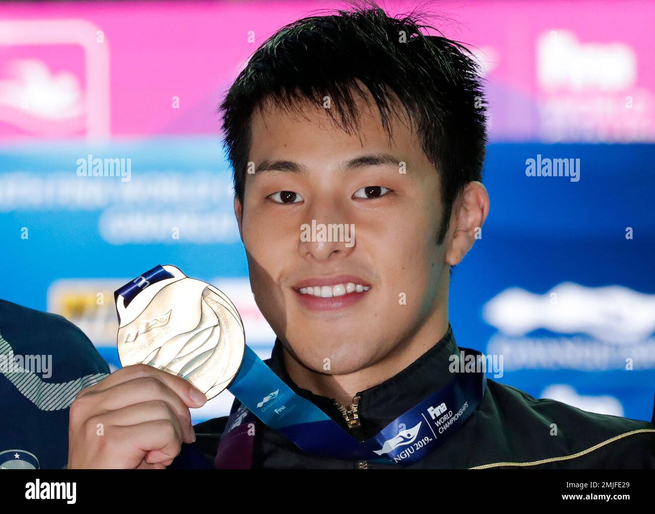 Gold medalist Japan's Daiya Seto poses with his medal following the men ...