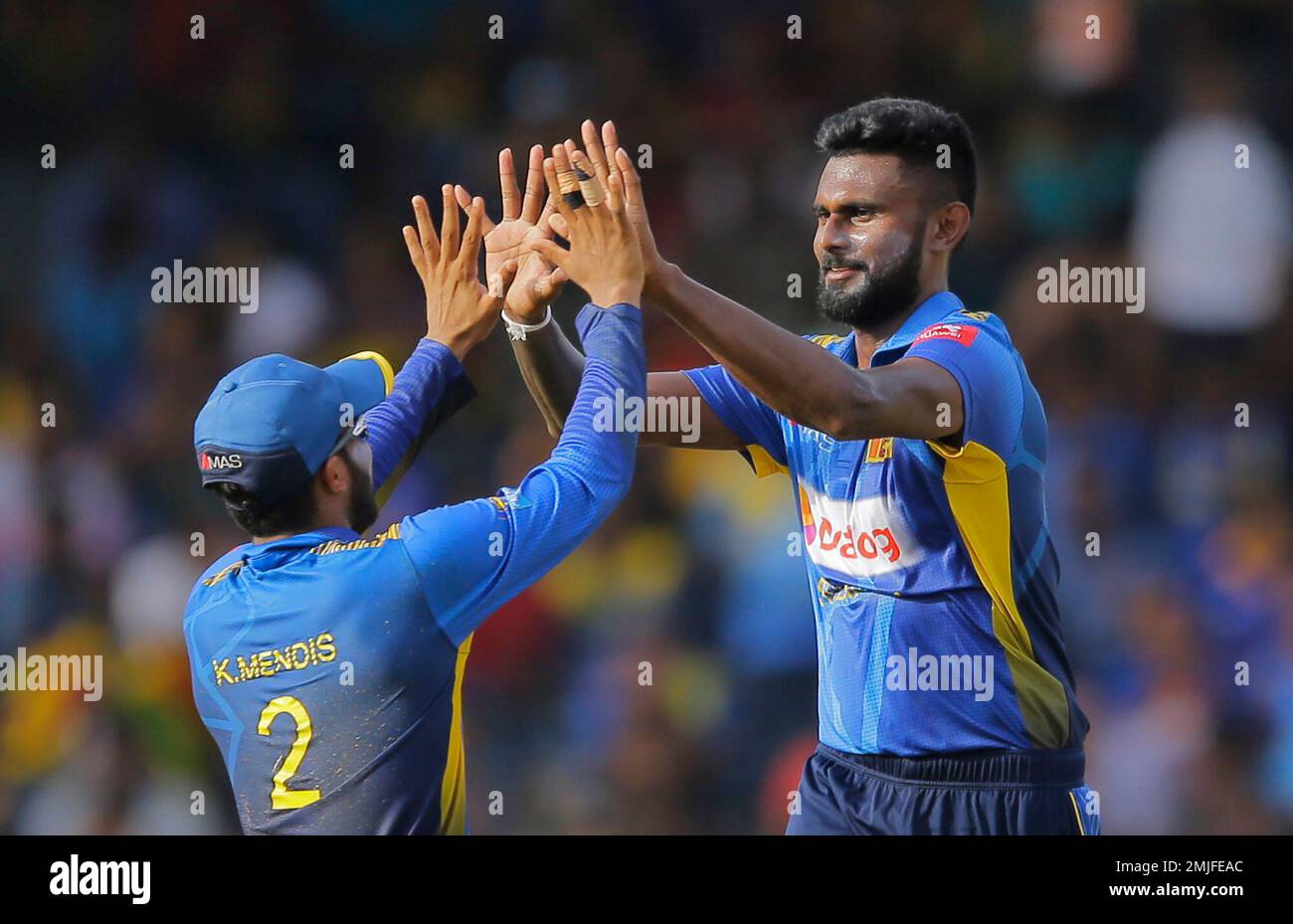 Sri Lankan bowler Isuru Udana, right, celebrates taking the wicket of ...