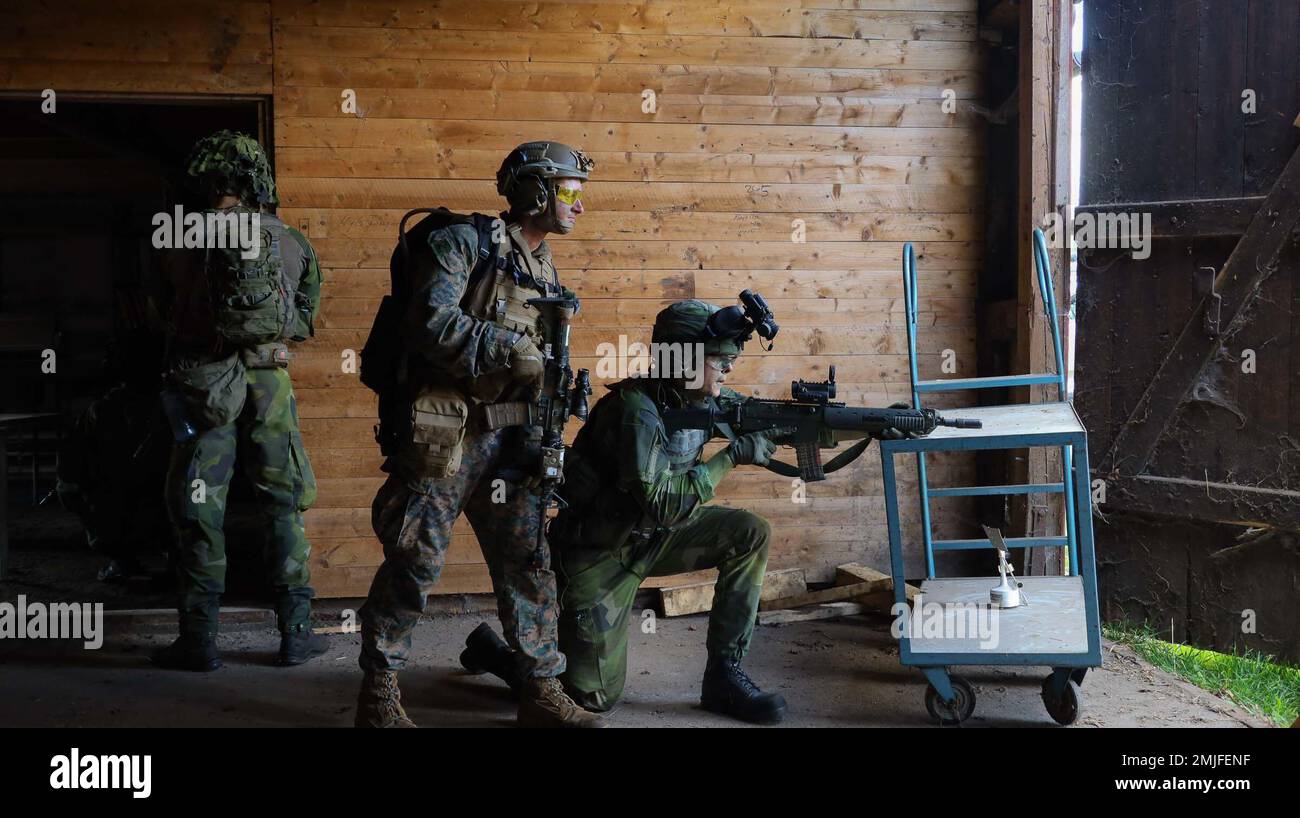 U.S. Marine Corps Lance Cpl. Ethan Fankhauser, center, assigned to ...