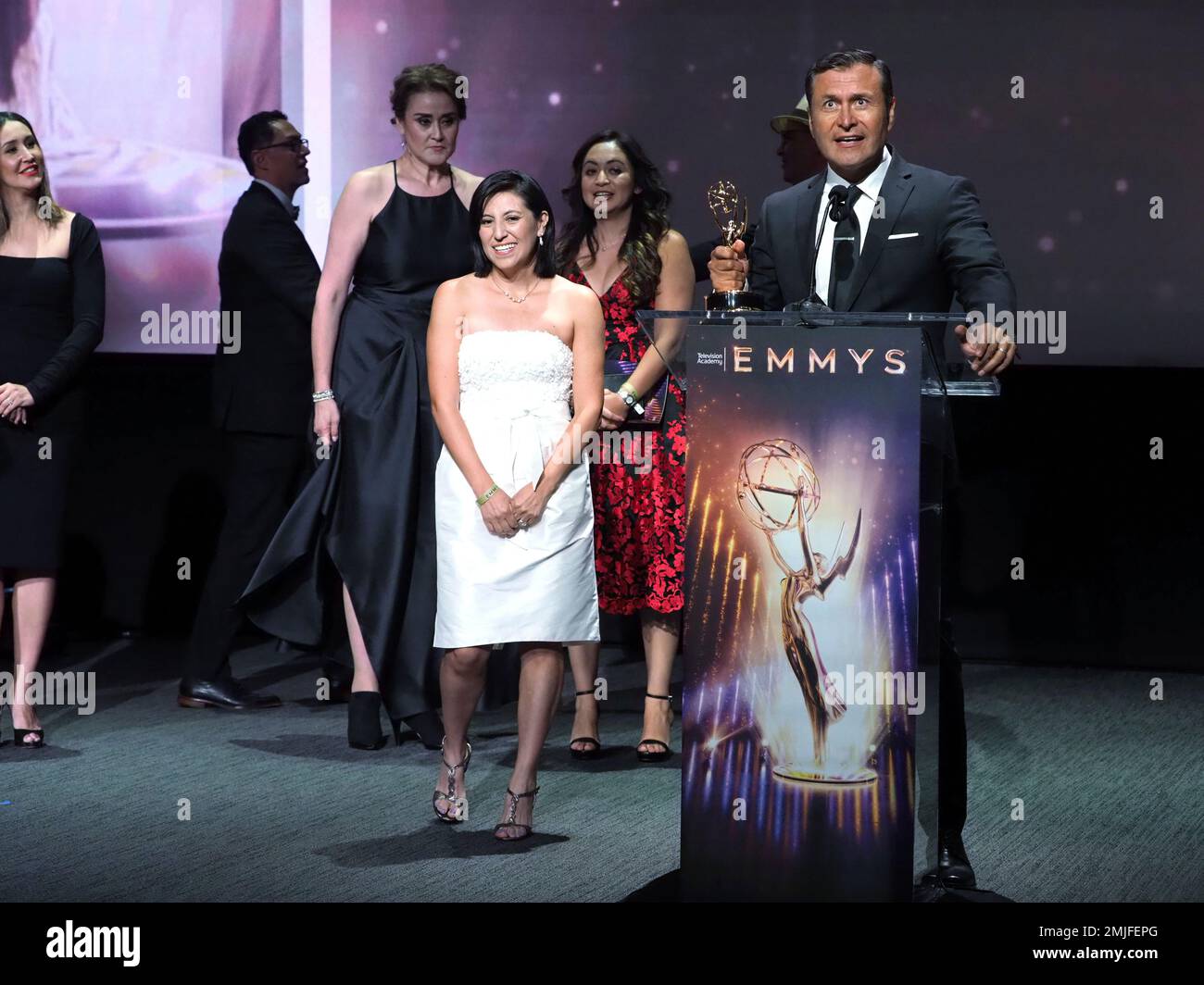 EXCLUSIVE - The KMEX News Team accepts the Emmy for education ...