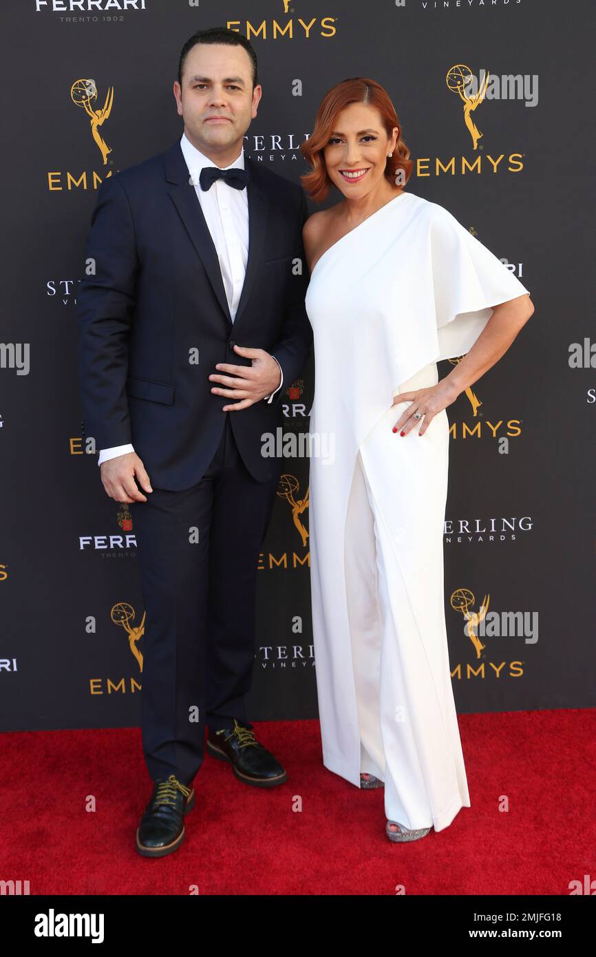 Guillermo Ochoa, left, and Ana Patricia Candiani arrive at the 71st Los ...
