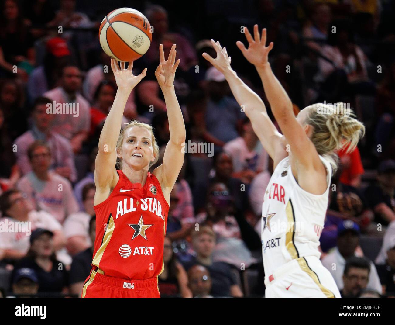 Chicago Sky's Allie Quigley, of Team Wilson, left, shoots over Chicago ...