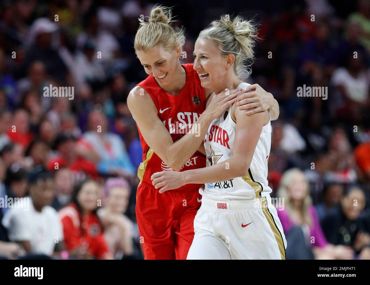 Chicago Sky's Allie Quigley, of Team Wilson, left, embraces Chicago Sky ...