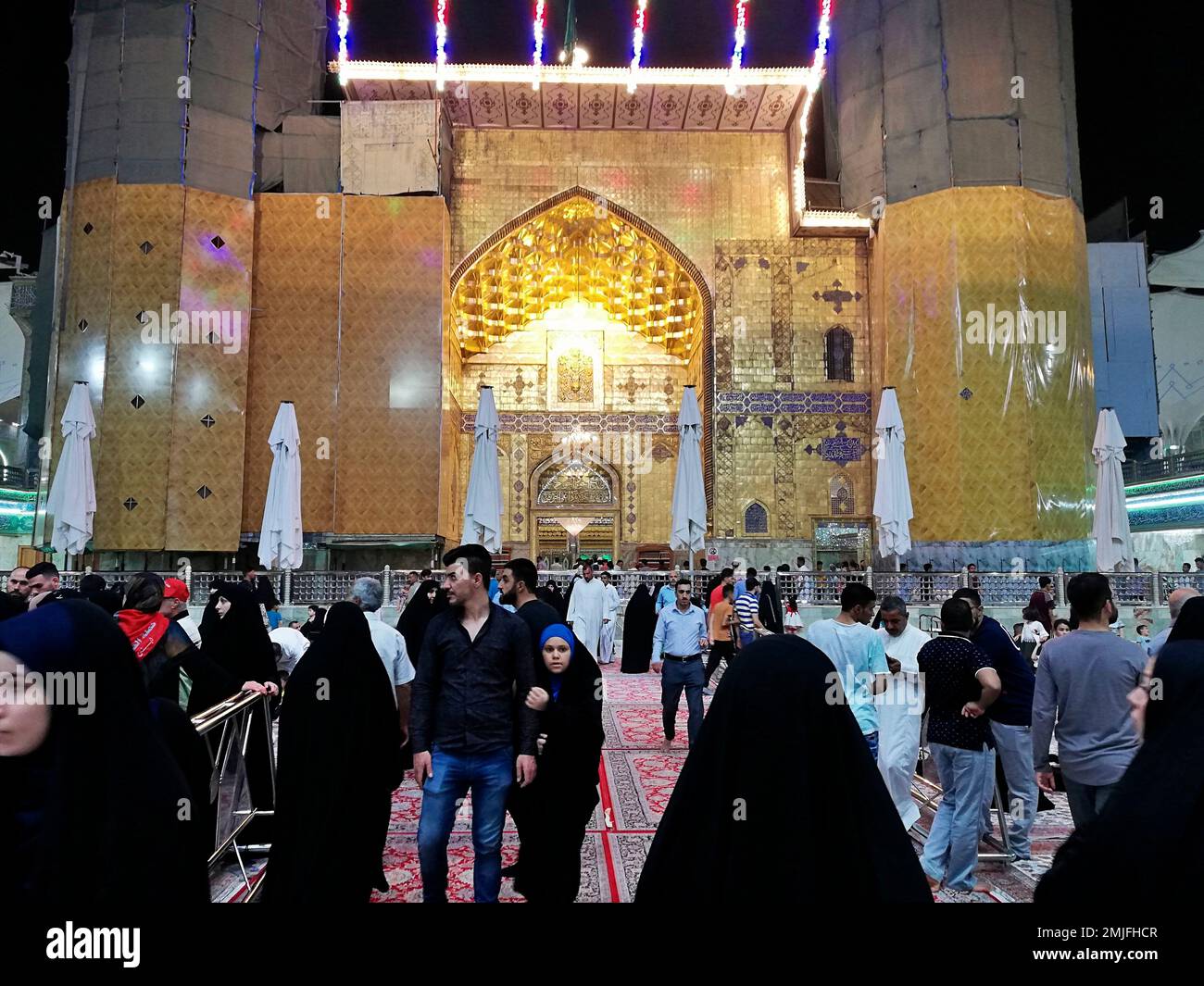 Shiite Muslim worshippers visit the holy shrine of Imam Ali, the son-in ...