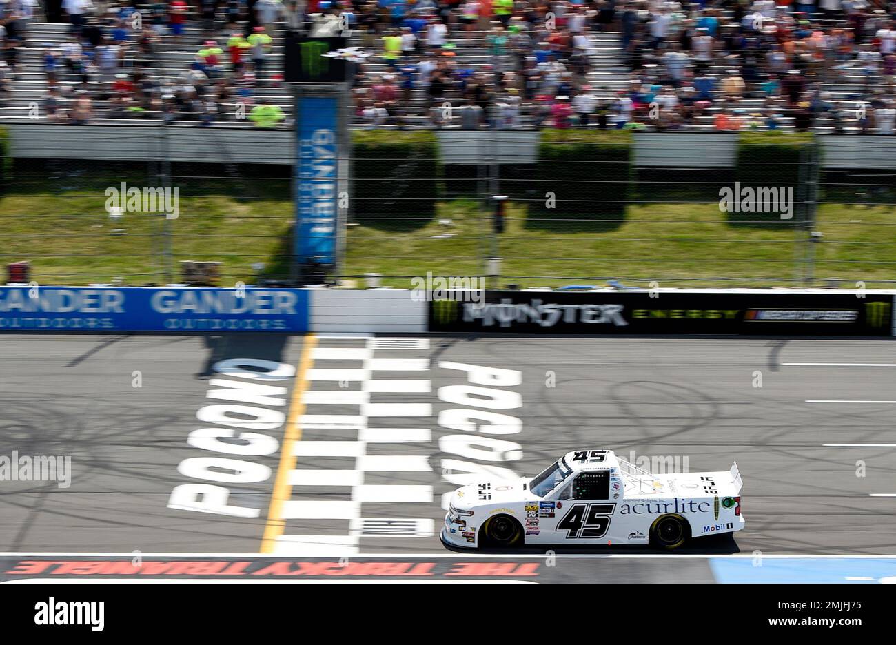Ross Chastain crosses the finish line to win a NASCAR Truck Series auto ...