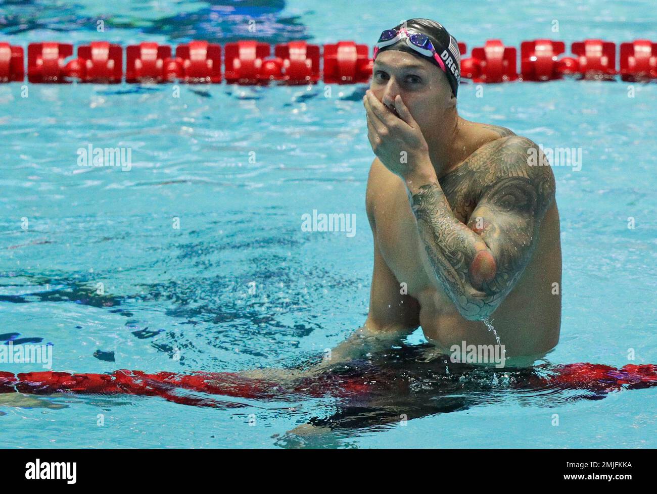 United States' Caeleb Dressel reacts after winning the men's 100m ...