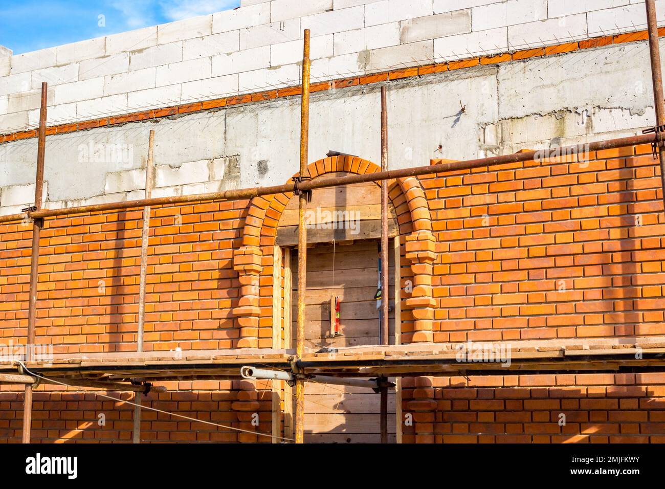 Construction of an old-style building with arched windows Stock Photo ...