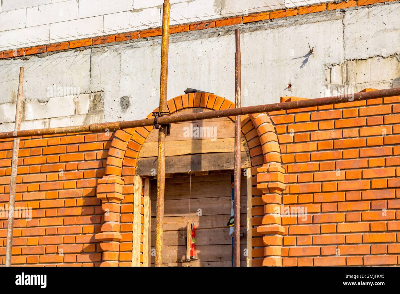Construction of an old-style building with arched windows Stock Photo ...