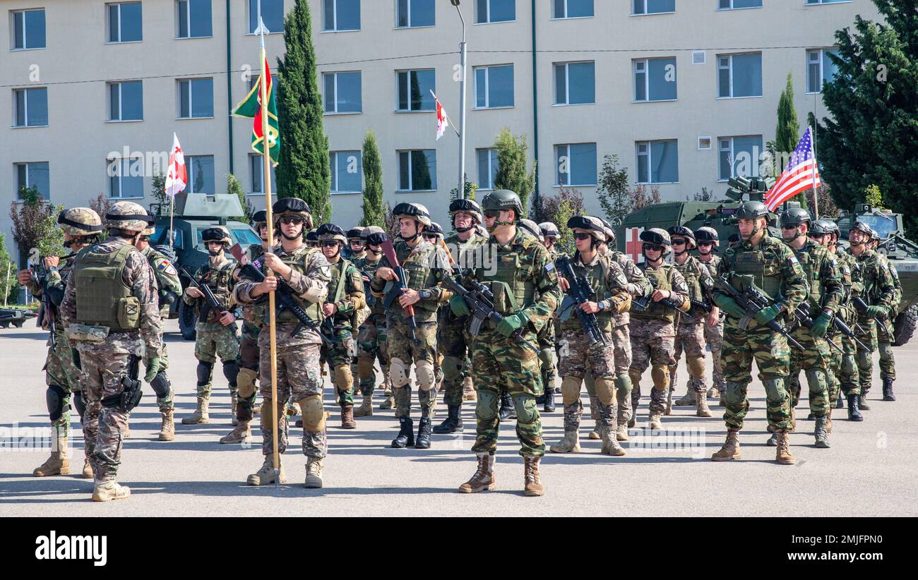 A Georgian Defense Forces officer addresses a multinational formation ...