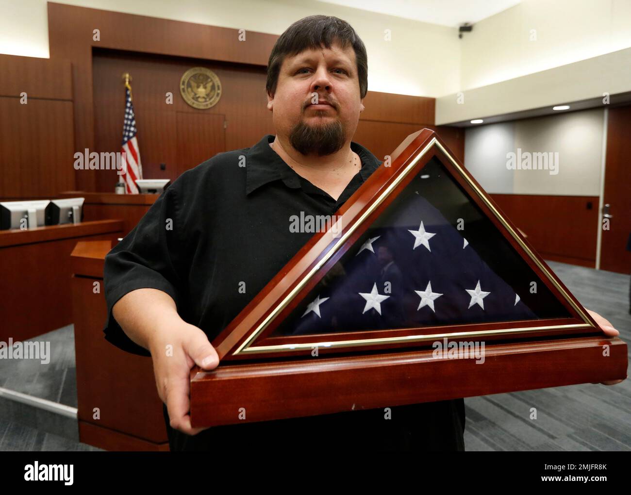 Gary Hulsey, a 40-year-old resident of Wylie, Texas, holds a folded ...