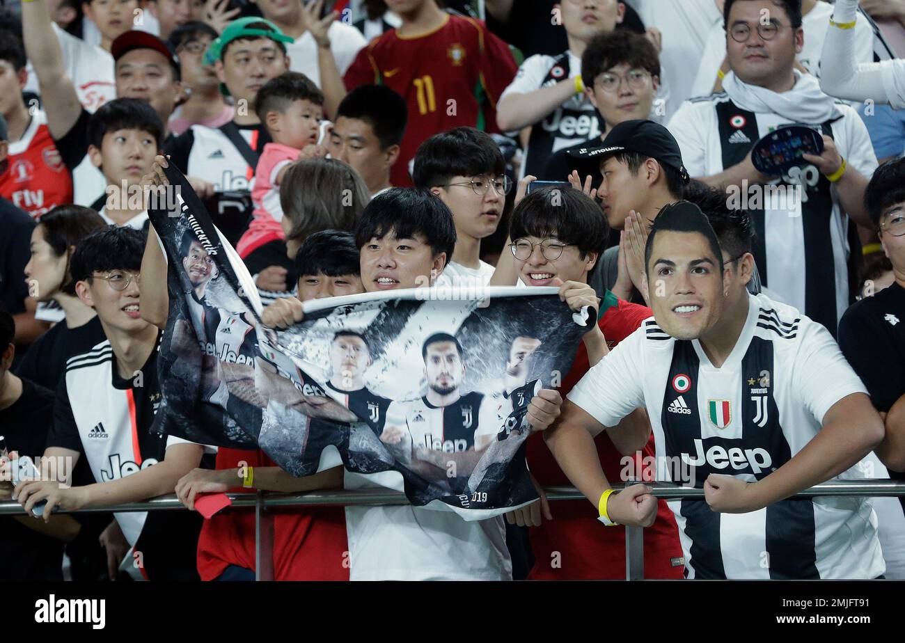 A South Korean soccer fans wears a mask of Cristiano Ronaldo of ...