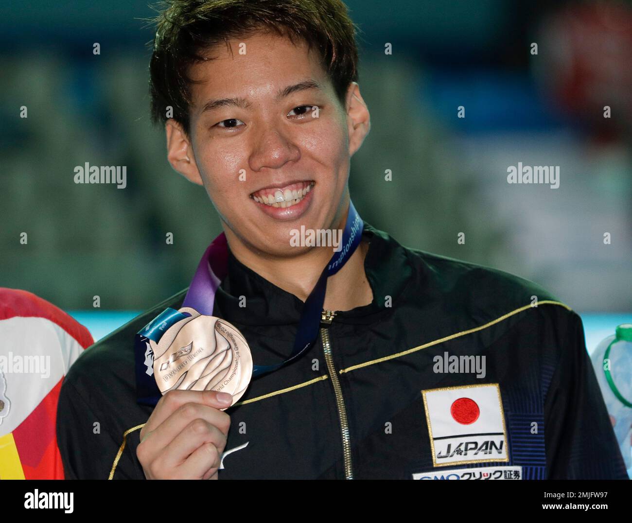 Bronze medalist Japan's Ippei Watanabe poses with his medal following ...
