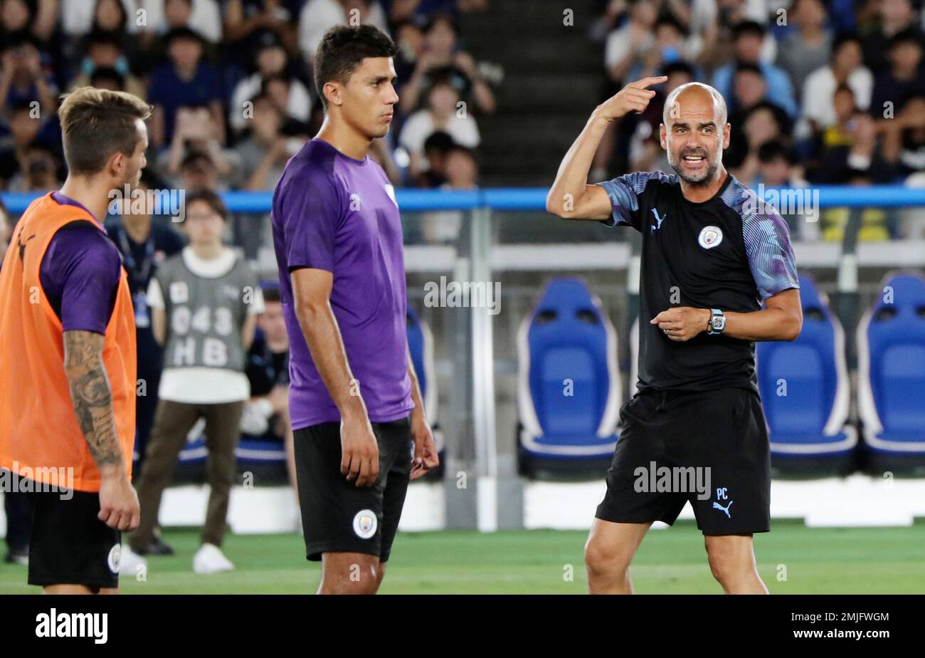 Manchester City's manager Pep Guardiola, right, gives his direction to ...