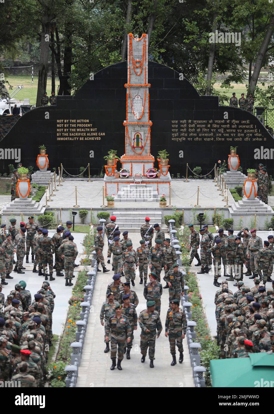 Indian army soldiers gather at a war memorial during Kargil Vijay Diwas ...